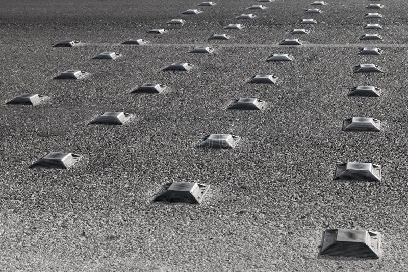 Metal Road Studs on Asphalt Highway Stock Image - Image of urban, sign ...