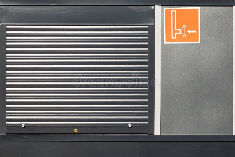 Metal Roller Shutter Door with Orange Sign Stock Photo - Image of ...