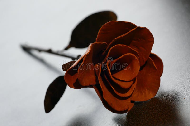 Metal rose on table stock image. Image of rose, orange - 253613089
