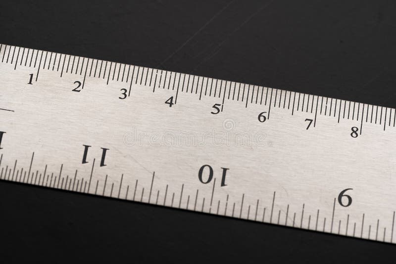 Metal Ruler on a Black Leather Background with Black Numbers and Scale ...