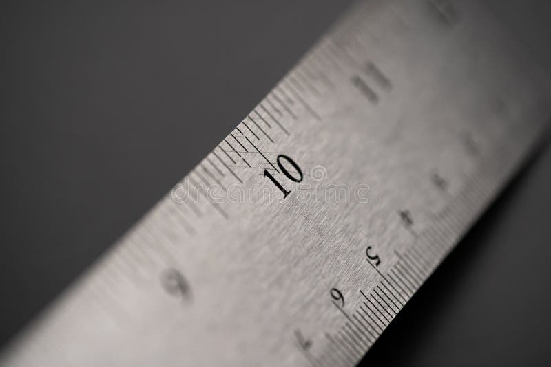 Metal Ruler on a Black Leather Background with Black Numbers and Scale ...
