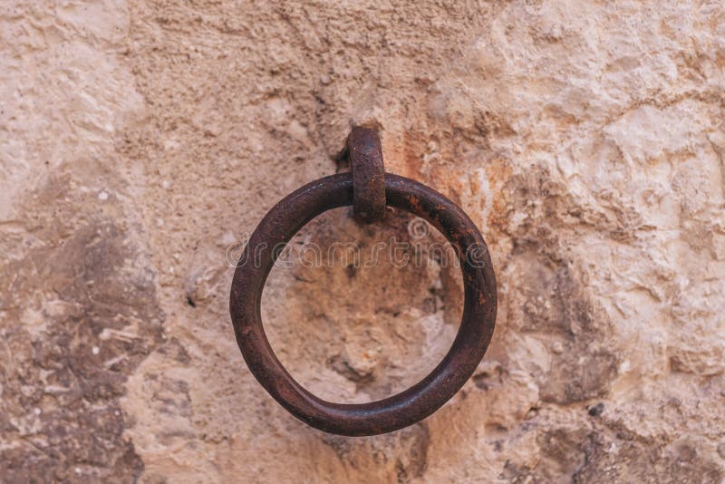 A Metal Rusty Ring is Driven into a Stone Wall Stock Photo - Image of ...