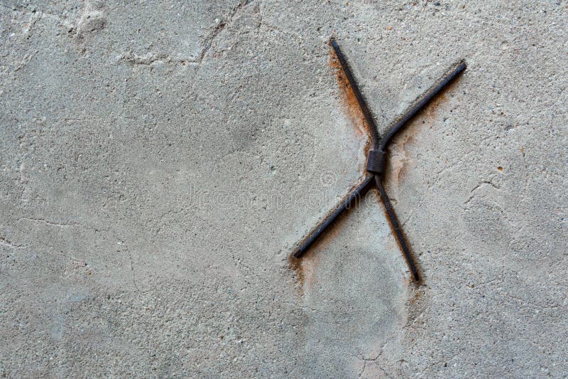 Metal Rusty Rods in the Form of a Cross on a Concrete Wall Stock Image ...