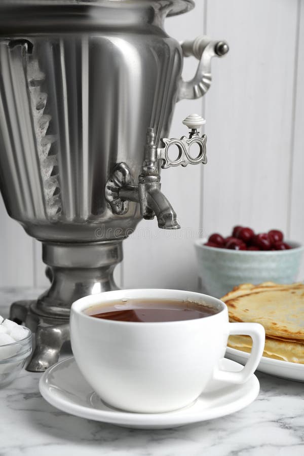 Metal Samovar and Cup of Tea on White Marble Table Stock Photo - Image ...