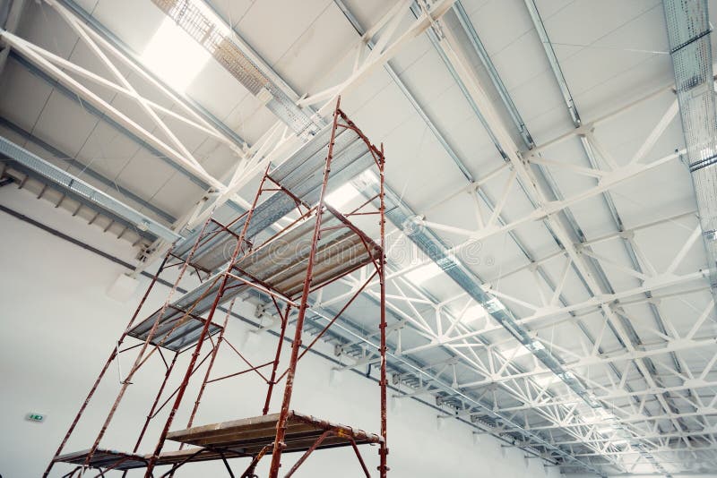 Scaffolding Standing in Empty Warehouse Building Under Construction ...
