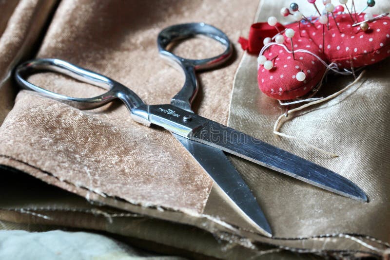 Metal Scissors and Pin on Brown Fabric Stock Photo - Image of industry ...