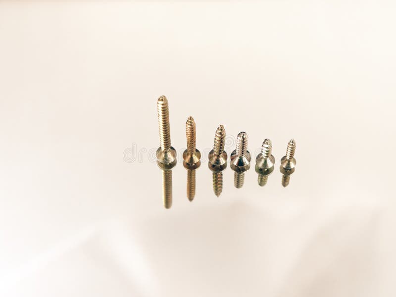 Yellow Hardware Screws on a White Background Stock Image - Image of ...
