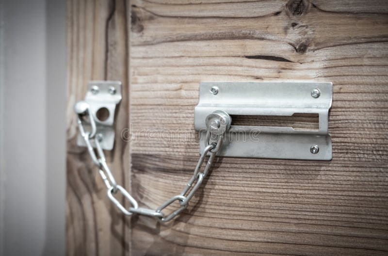 Metal Security Door Chain on Wooden Door Stock Photo - Image of ...