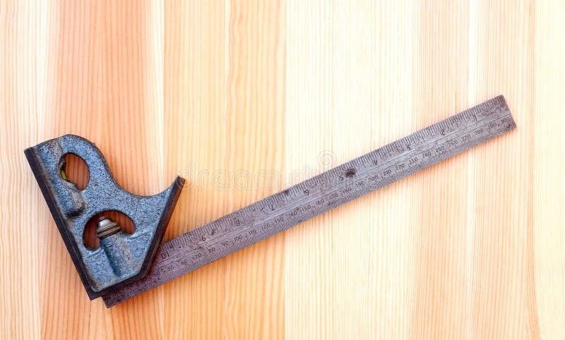 Metal set square on wood stock image. Image of tool, improvement - 34147937