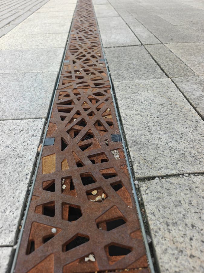 Metal Sewage Gutter Grid on a Sidewalk Stock Photo - Image of mesh ...