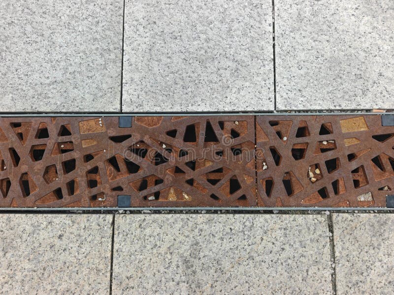 Metal Sewage Gutter Grid on a Sidewalk Stock Photo - Image of hole ...