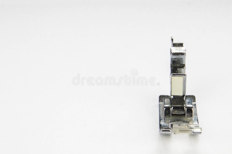 Metal Sewing Machine Foot Isolated on a White Background. Side View ...