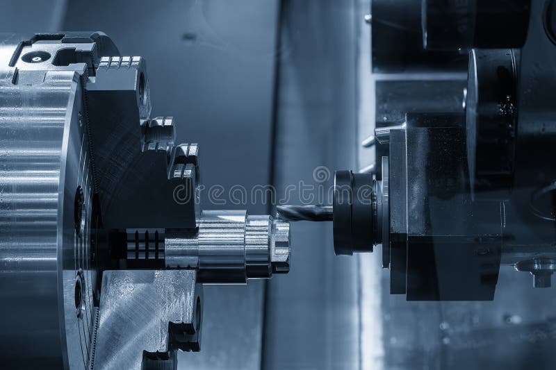 The Metal Shaft Milling Process on CNC Lathe Machine in the Light Blue ...