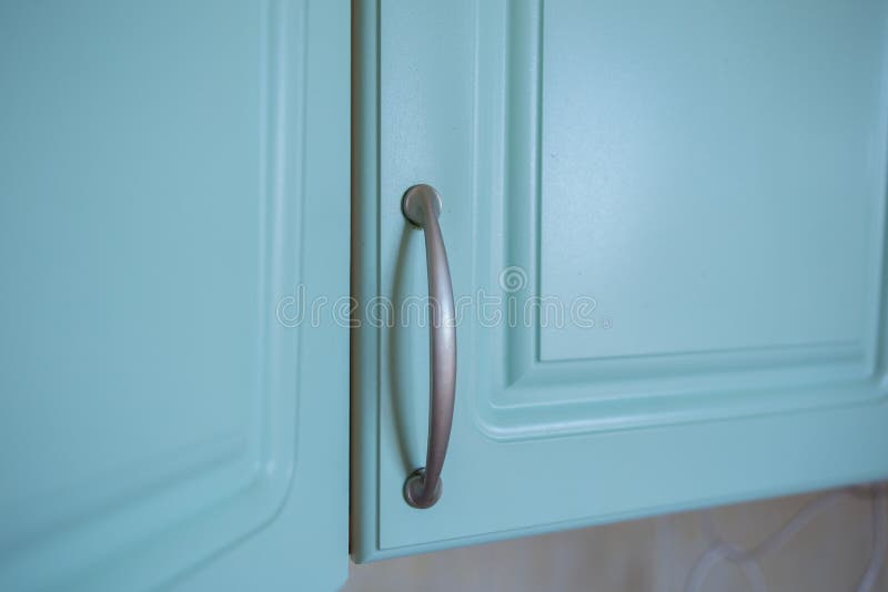 Metal Shelf Handles in a Blue Kitchen Stock Image - Image of dirty ...