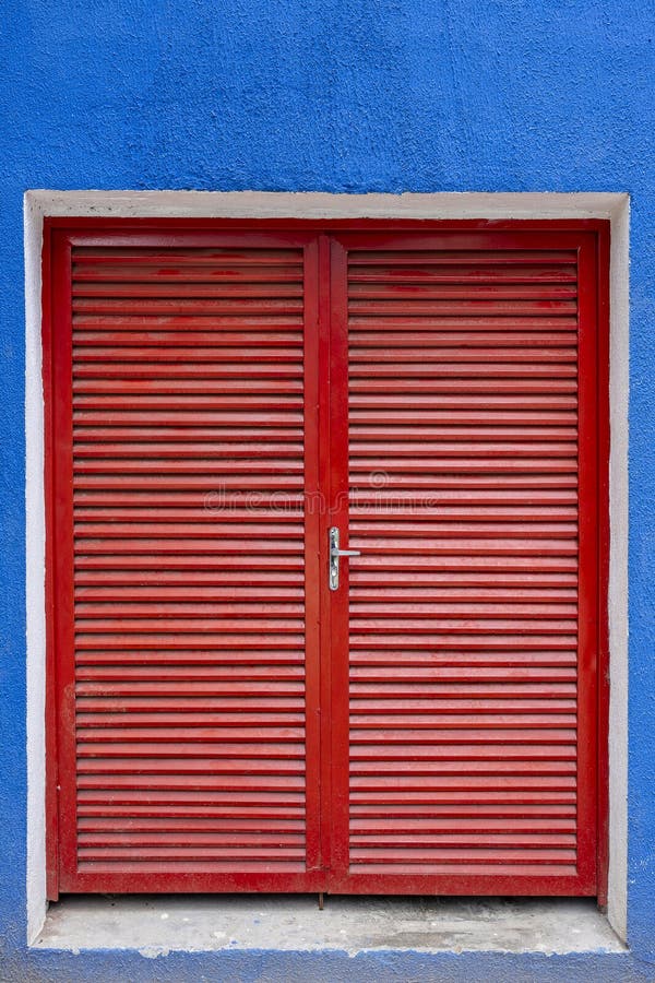 Metal Shutter Door Painted Red and Wall Painted Blue Stock Photo ...