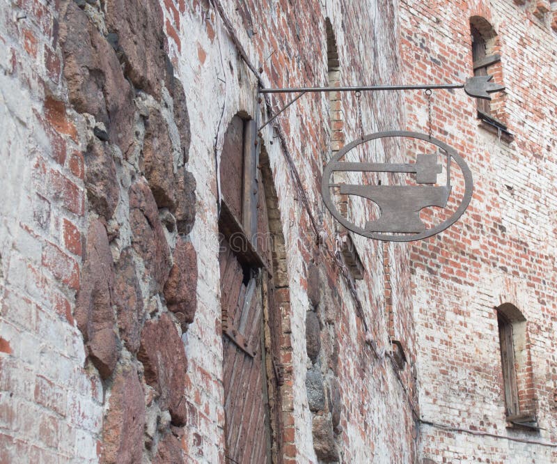 Metal Sign Forge with Anvil and Hammer on the Wall Stock Image - Image ...