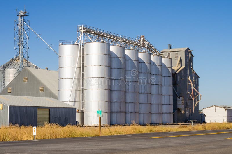 Metal Grain Storage Silo Facility Stock Photo - Image of land, grind ...