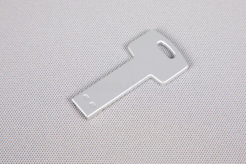 Metal Silver Key USB Flash Drive Ready To Connected on White Desk Grey ...