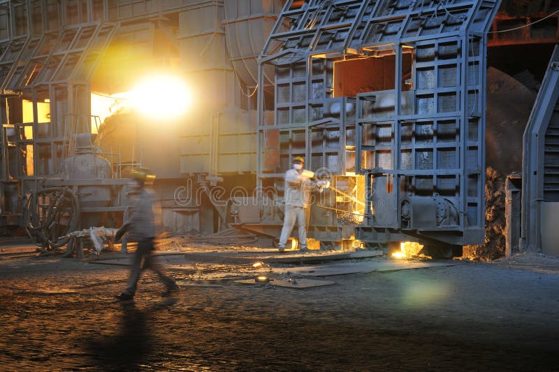 Metal smelting casting stock image. Image of intense - 220878933