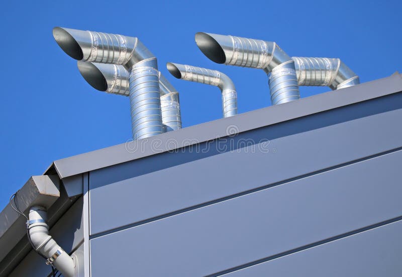 Metal Smoke Stacks on the Top of an Industrial Building Stock Image ...