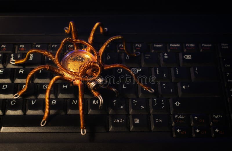 Metal Spider on the Computer Keyboard, Virus, Theme of Information ...