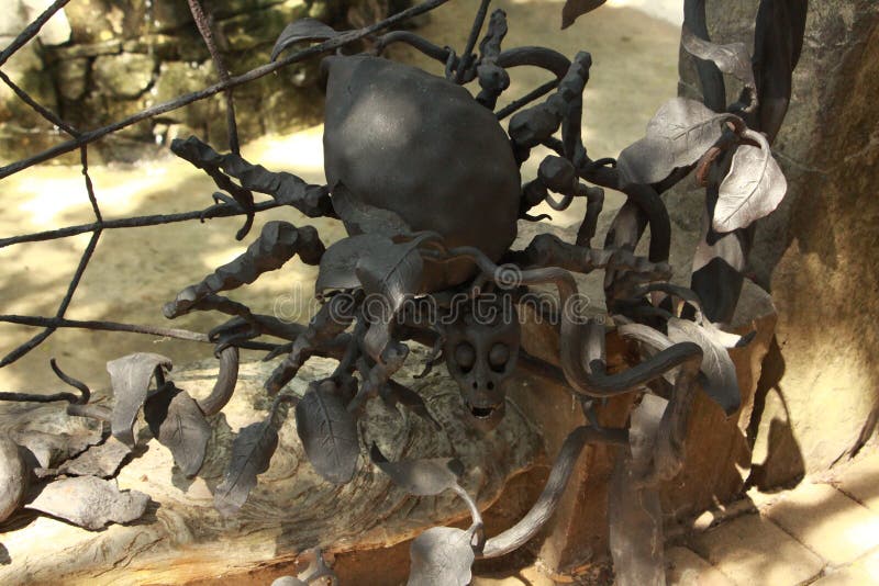 A metal spider spun a web stock image. Image of black - 184409387