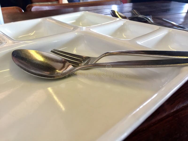 Metal Spoon and Fork on White Dinner Plate Stock Image - Image of dish ...
