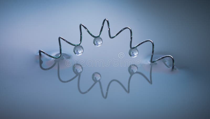 Metal Spring with Water Droplets Reflection Stock Image - Image of ...