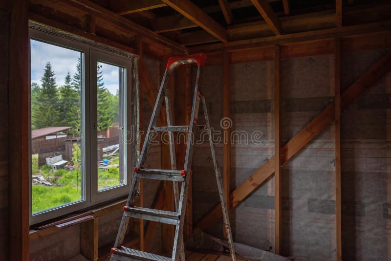 A Metal Staircase Inside a Frame House Under Construction. the Concept ...