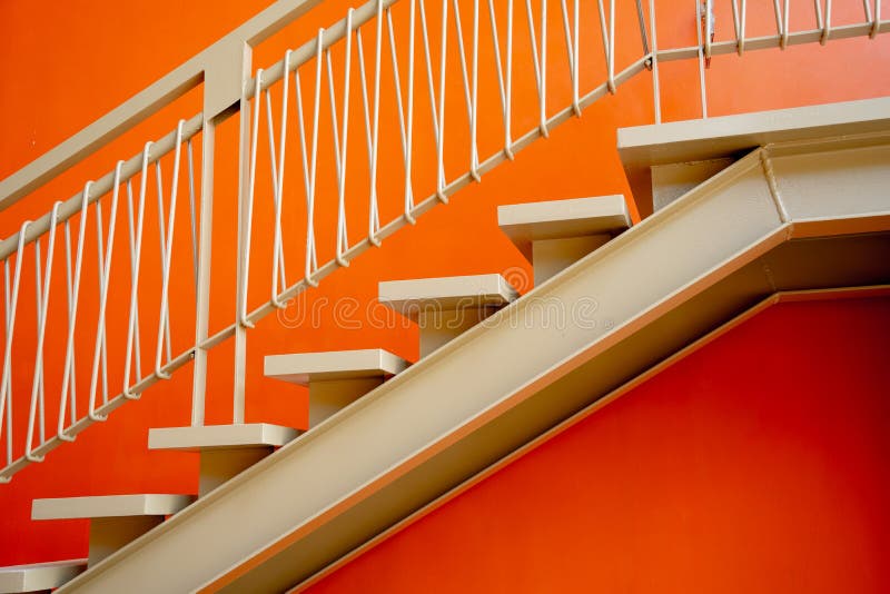 Metal Stairs on the Big Orange Wall Stock Photo - Image of step, steps ...