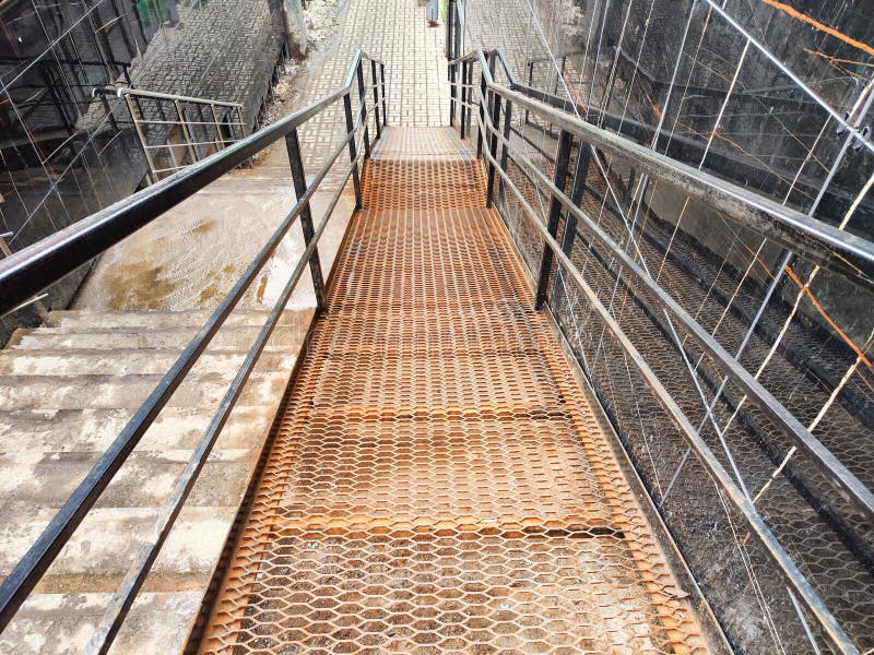 Metal Stairway with Grated Surface Leading Down at a Construction Site ...