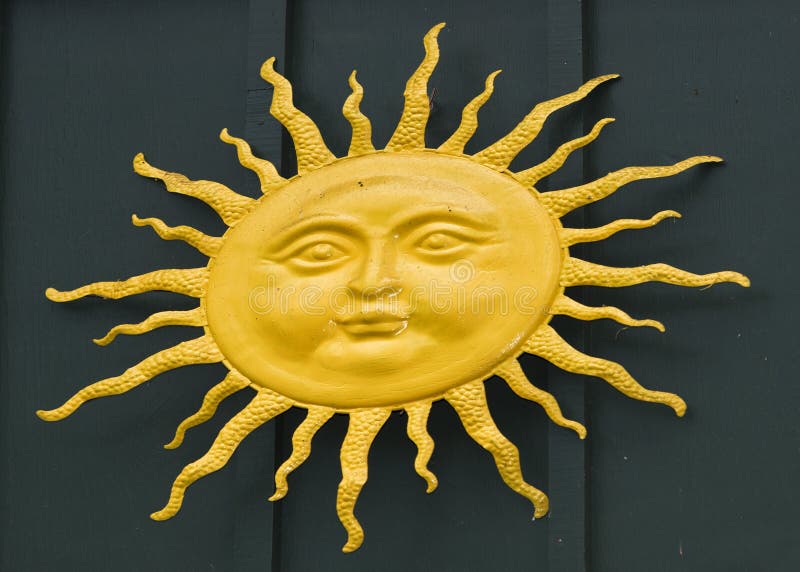 Metal Sun on Green Wood Background Stock Image - Image of warm, style ...
