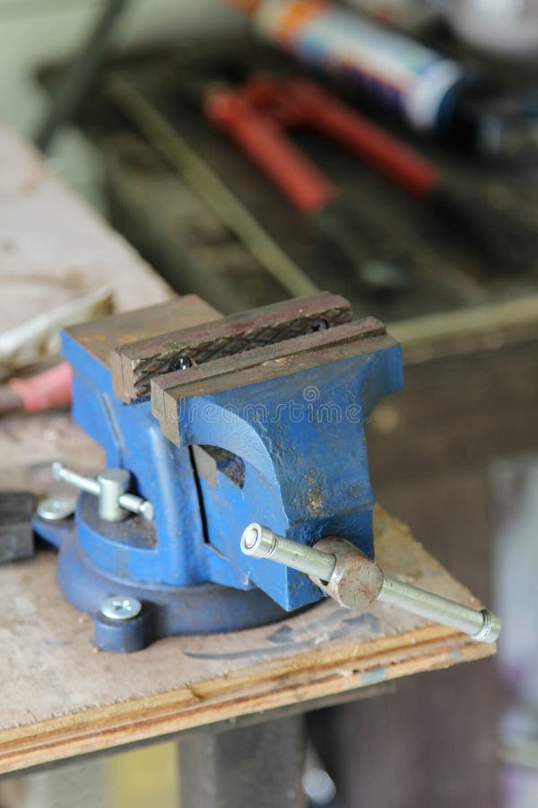 Table vise clamp on table stock image. Image of table - 271432425