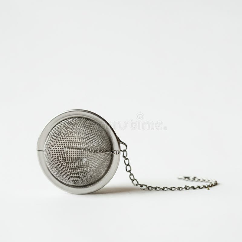 A Metal Tea Infuser with a Spherical Mesh Design is Shown Against a ...