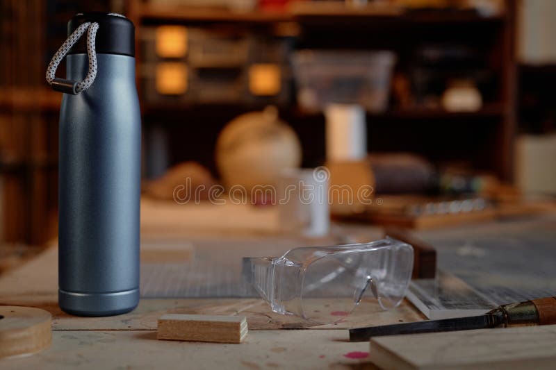 Metal Thermos in Workshop Setting Featuring Gadgets Stock Image - Image ...