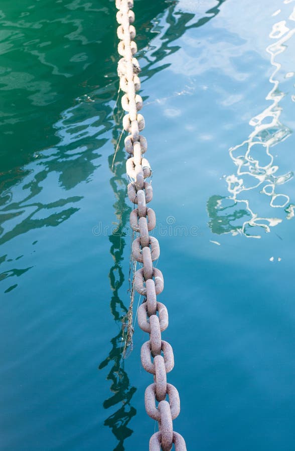 Metal Thick Chain Reflected in Blue Water Stock Photo - Image of thick ...