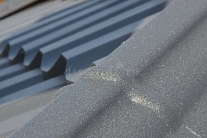 Metal Tile on Construction of Building. Roof of House Concept Stock ...