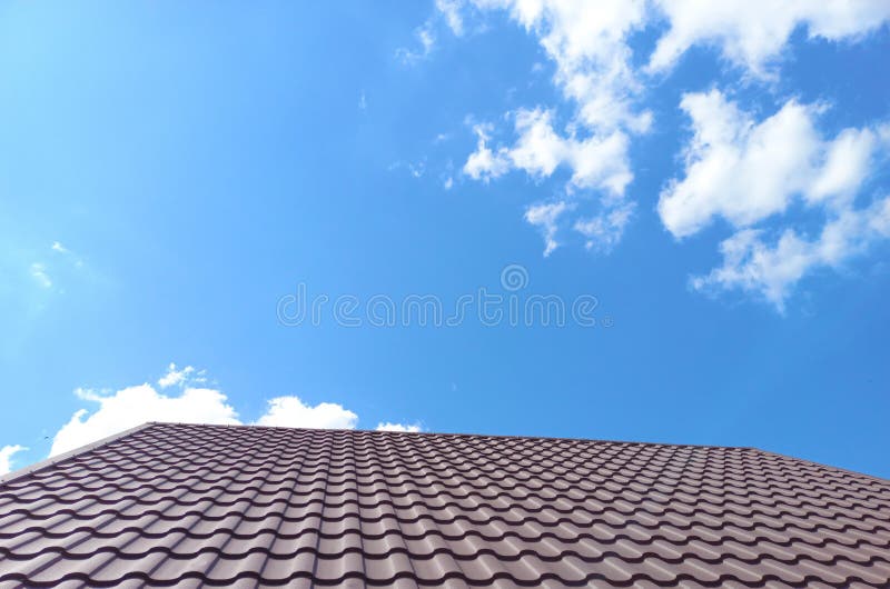 A Metal Tile Roof Against a Blue Sky Stock Image - Image of industry ...