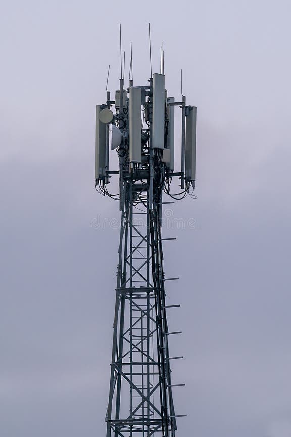 Metal Tower with Multiple Cellular Repeaters Against Cloudy Sky. Stock ...