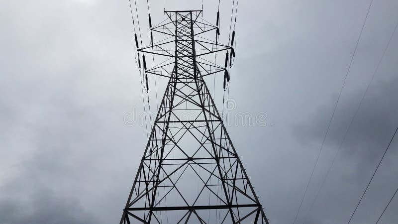 Metal Tower with Power or Electrical Lines and Clouds Stock Photo ...