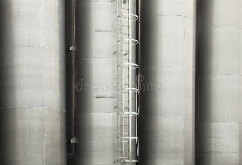Metal Tower Silos of the Industrial Plant Stock Photo - Image of black ...