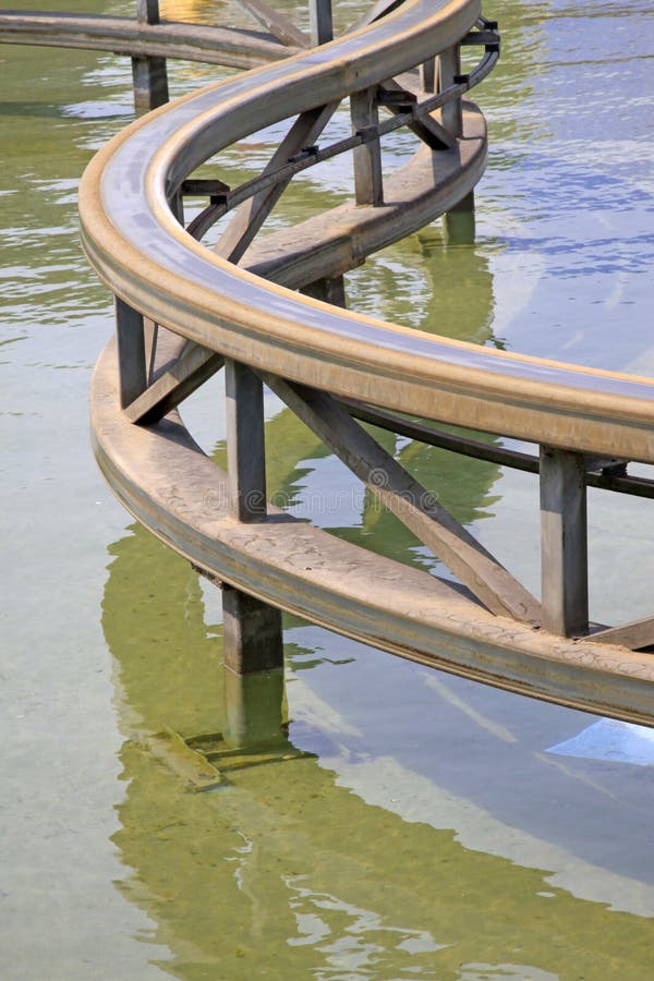 Metal tracks on the water stock image. Image of water - 390597417