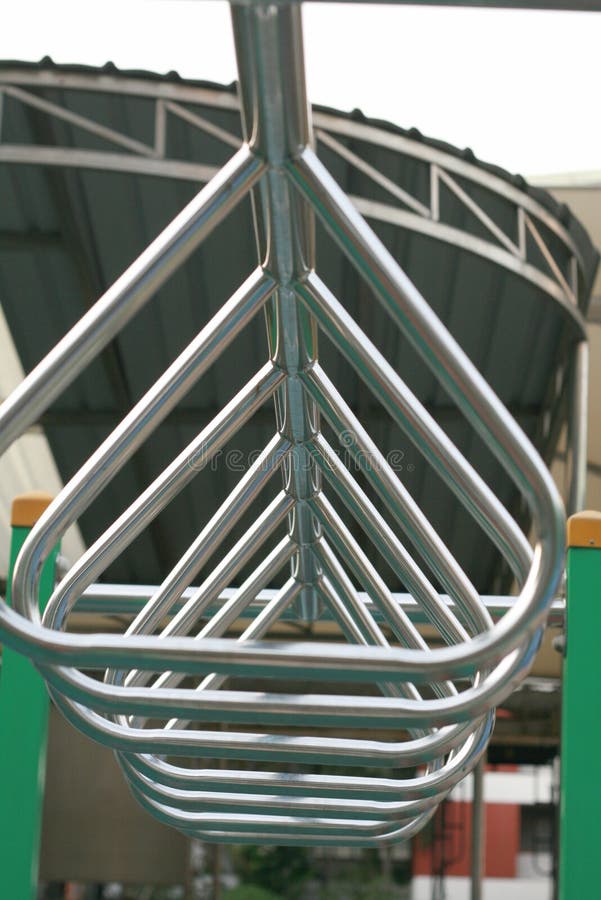 Metal Triangle Bar in a Playground Stock Image - Image of recess ...