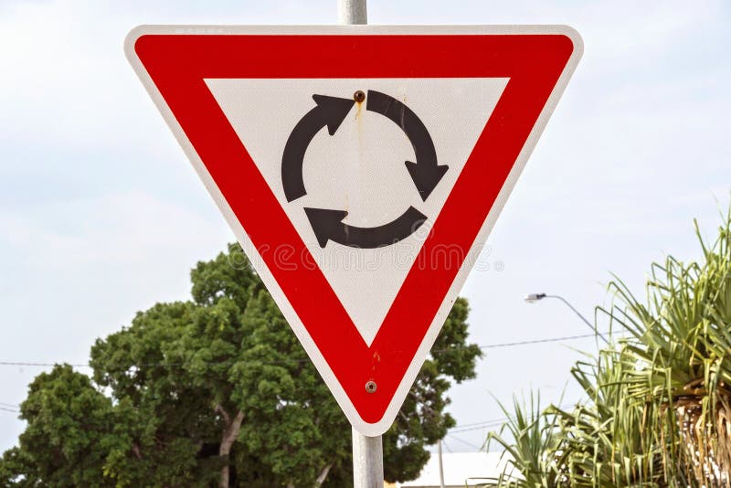 A Metal Triangular Roundabout Sign Stock Photo - Image of road ...
