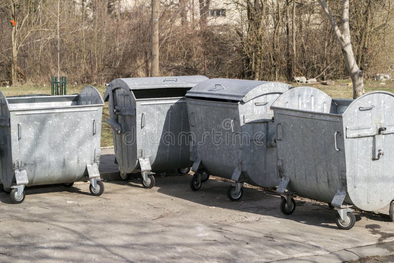 Metal Waste Container with Wheels.Four Empty Garbage Bin Stock Image ...