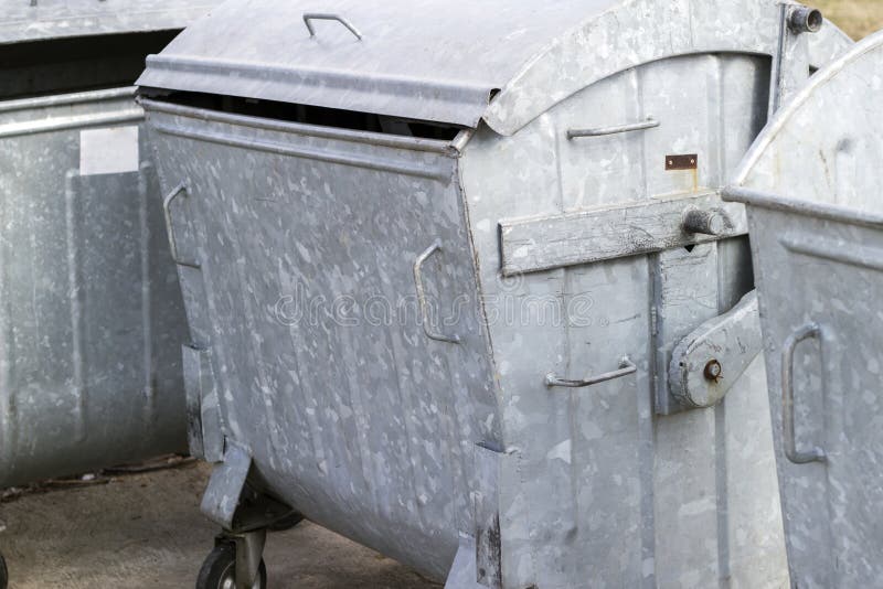 Metal Waste Container with Wheels.Three Empty Garbage Bin Stock Photo ...