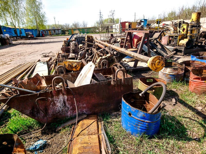Metal Waste Contaminated with Oil, Lay on the Floor in the Workplace ...