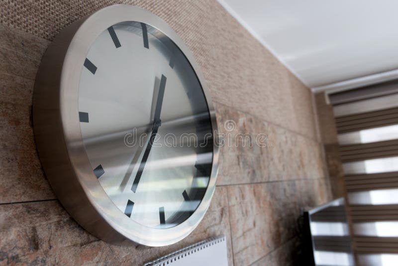 Metal watch on the wall stock image. Image of modern - 103616043