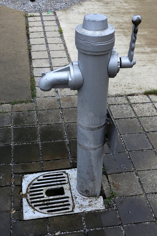 Metal Water Pipe and Faucet Stock Photo - Image of street, wall: 126532908