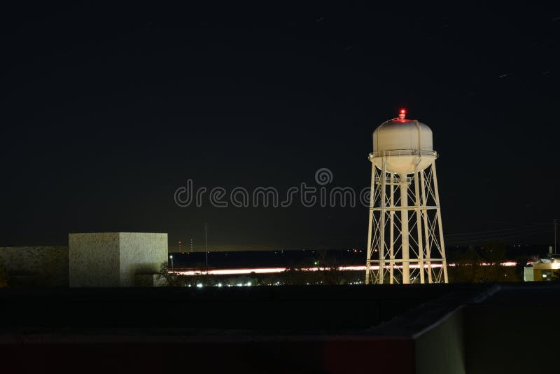 Metal Water Tower at Night with a Red Beacon on Top Stock Image - Image ...